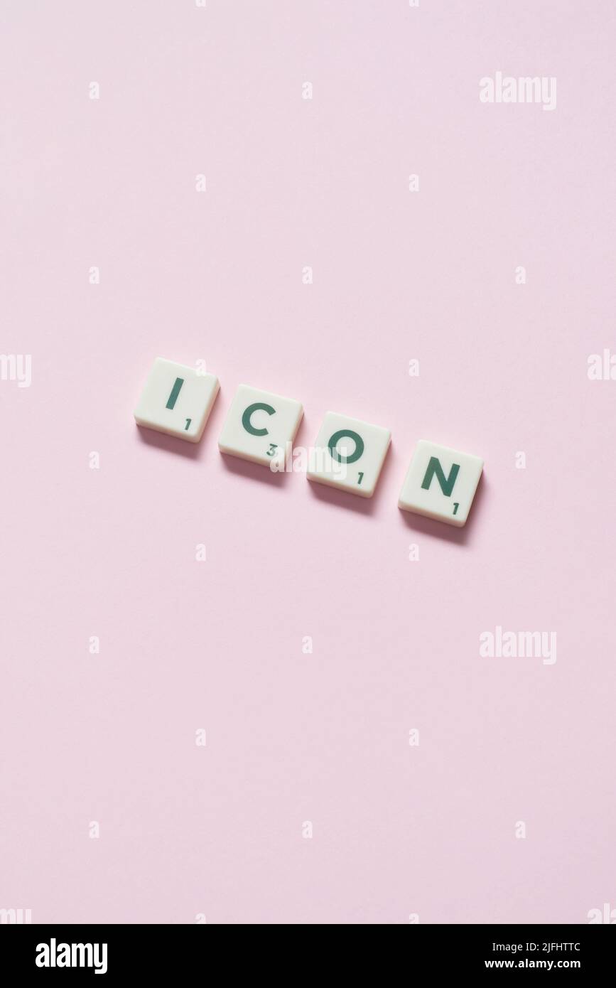 Icon formed of scrabble tiles on pink background Stock Photo - Alamy
