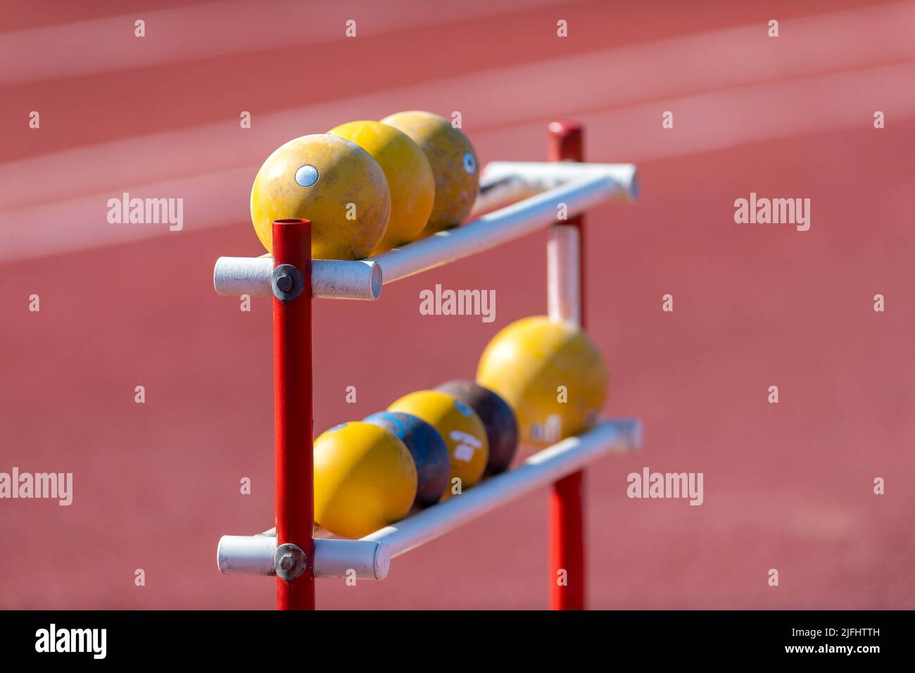 Shot put prepared for competition. Track and field background ...