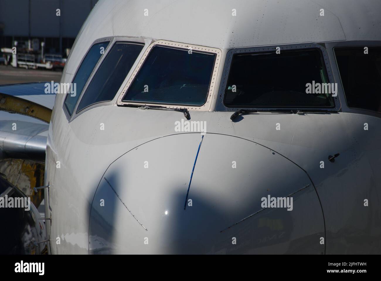 Jet sitting at an airport gate, ready to board Stock Photo - Alamy