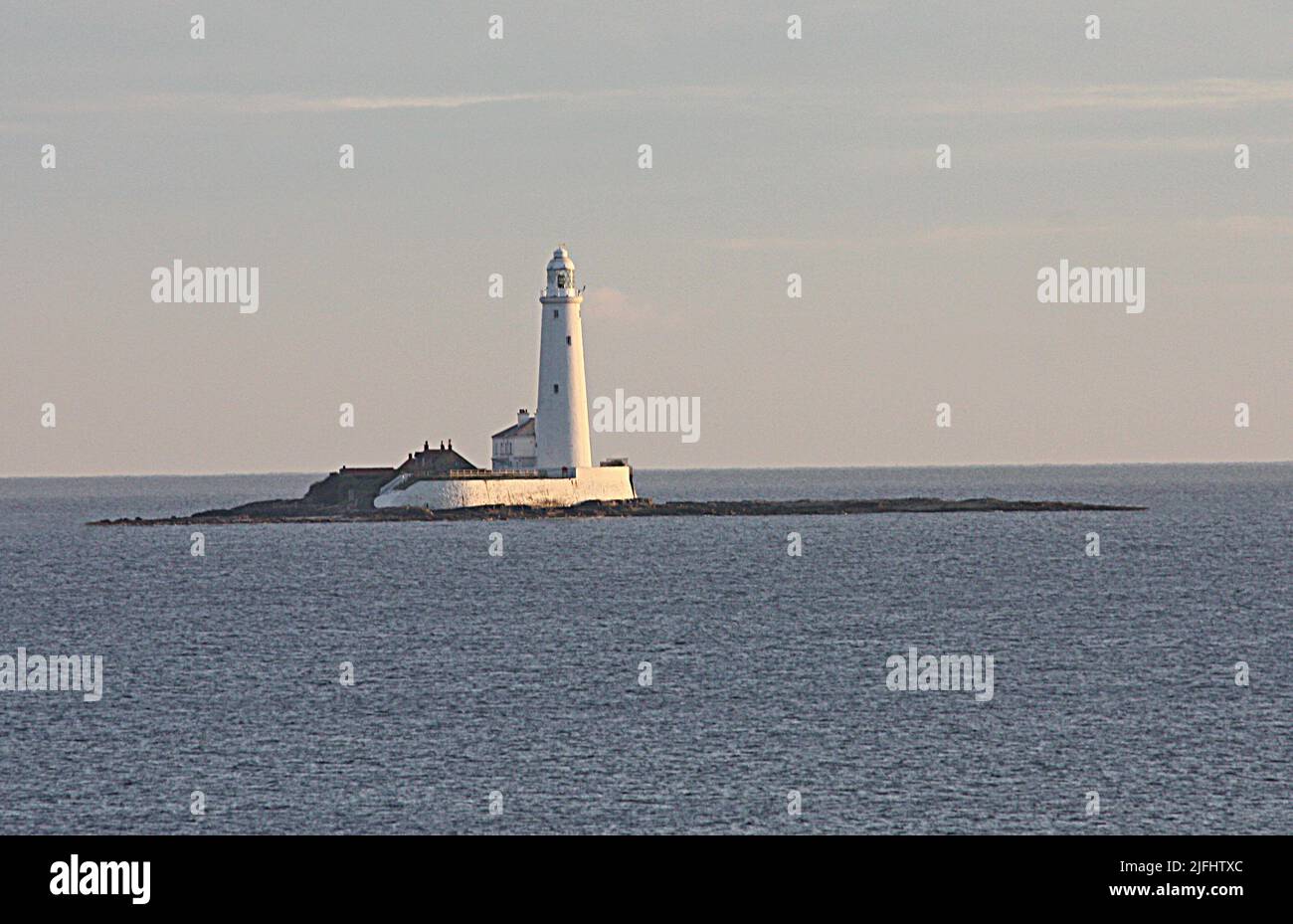 A British Coastal Lighthouse on an Island Stock Photo - Alamy