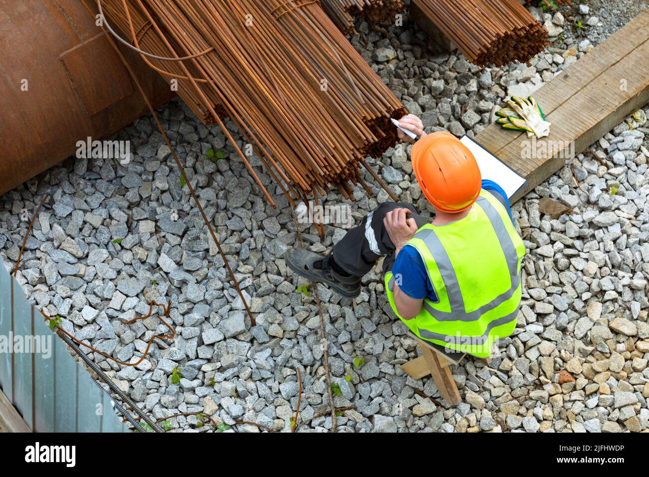 Worker making marks on metal reinforcement bars Stock Photo - Alamy