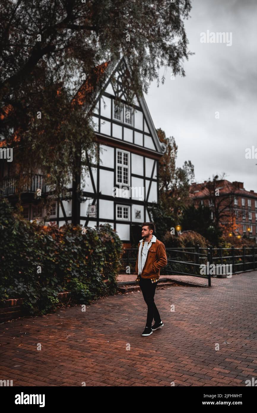 Man walking past The House of the Millers' Guild in old town Gdańsk ...