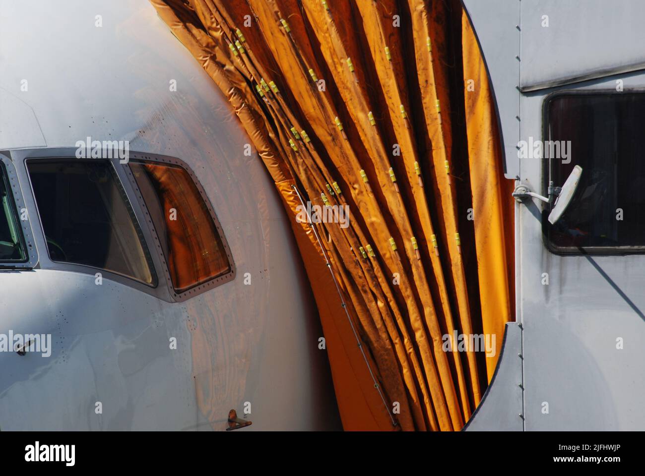Jet sitting at an airport gate, ready to board Stock Photo - Alamy