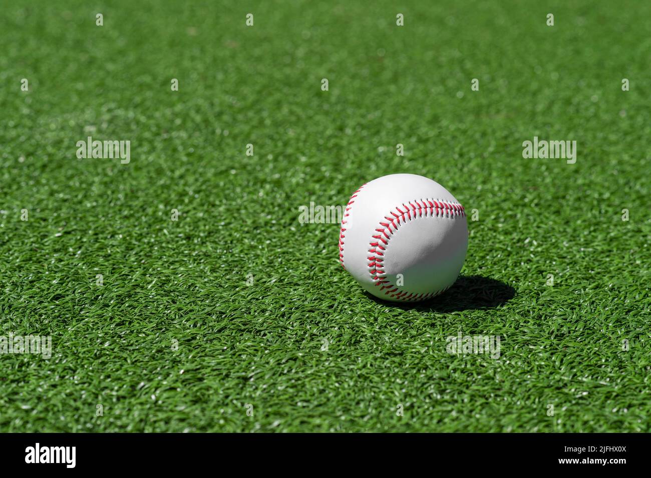 Baseball ball on green grass field. Sport theme background. Horizontal ...