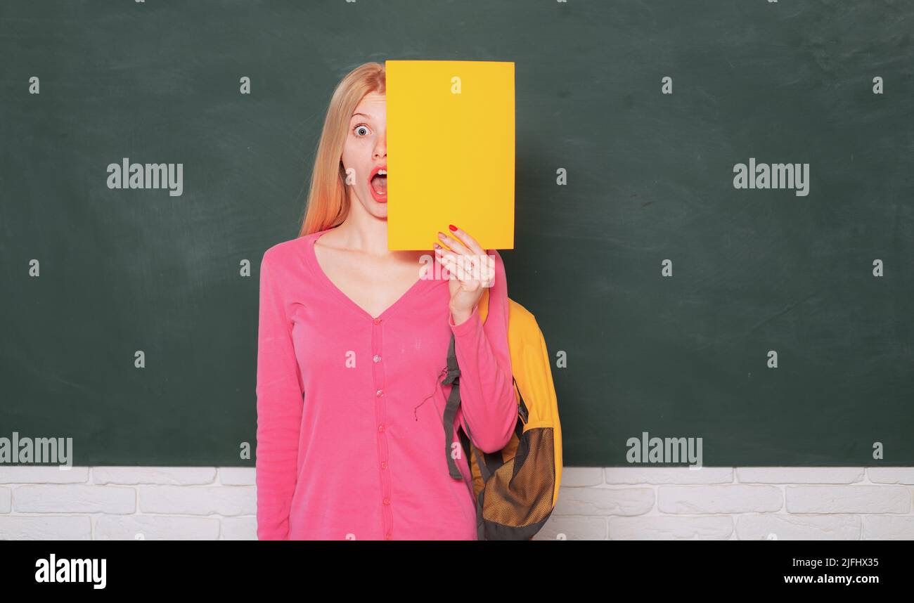 Improving myself through education. Happy girl holding announcement ...