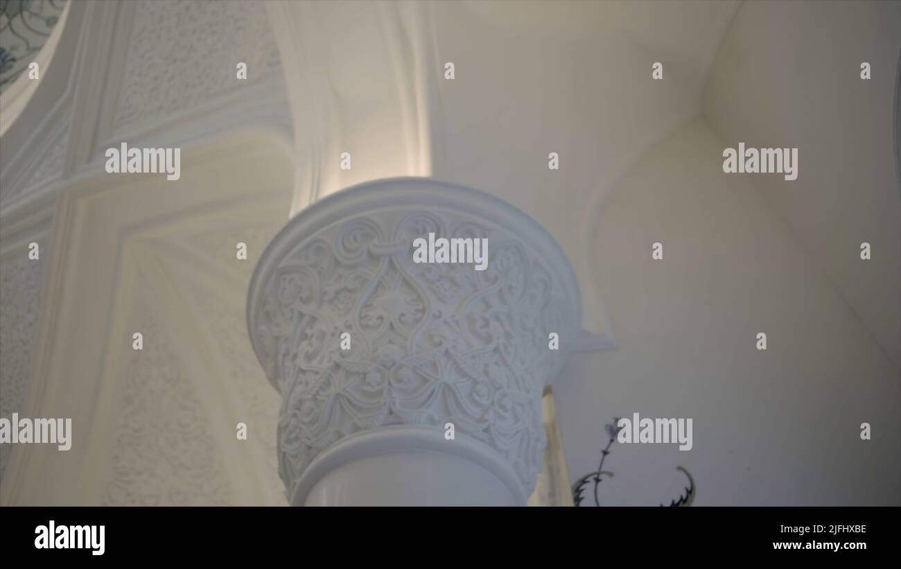Interior of the mosque with decorative ceiling and walls. Scene. White ...