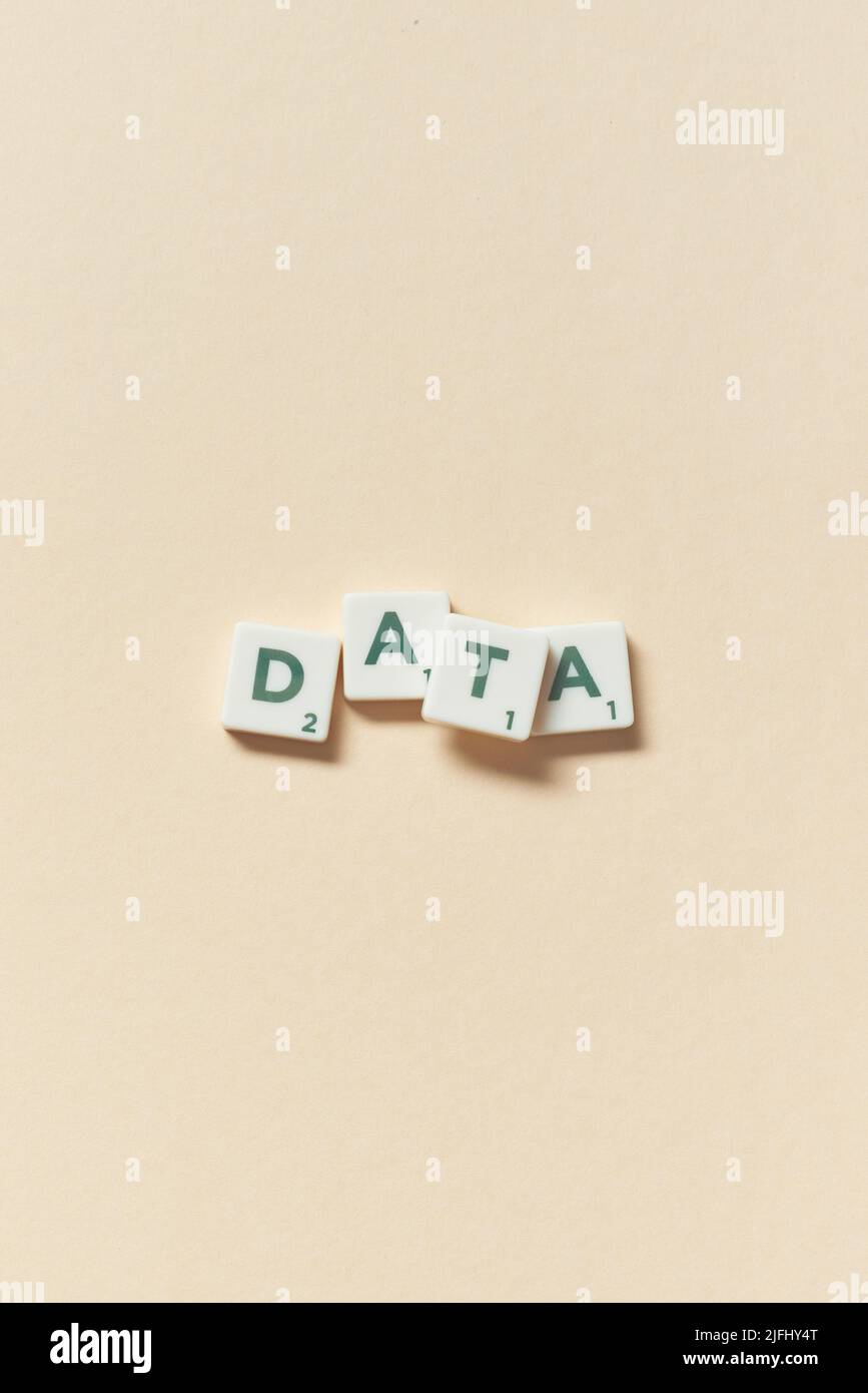 Data formed of scrabble blocks on beige background Stock Photo - Alamy