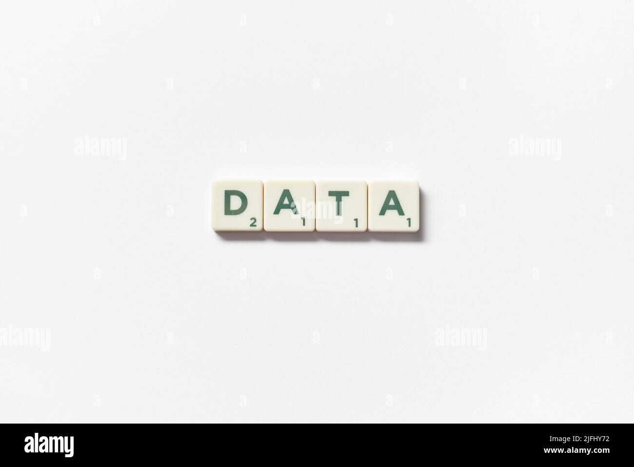 Data formed of scrabble tiles on white background Stock Photo - Alamy