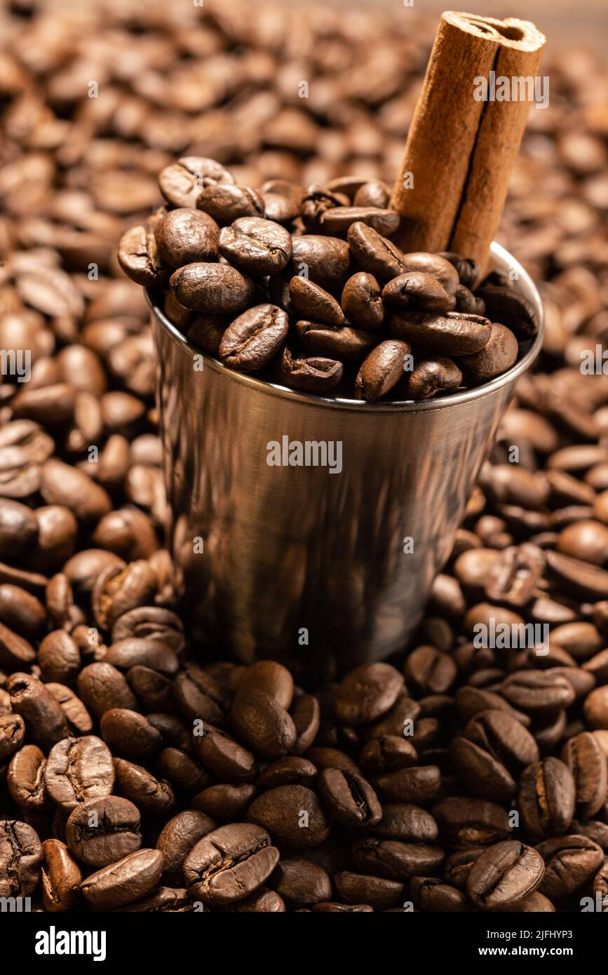 Full bucket and rash near a bucket of coffee beans Stock Photo - Alamy