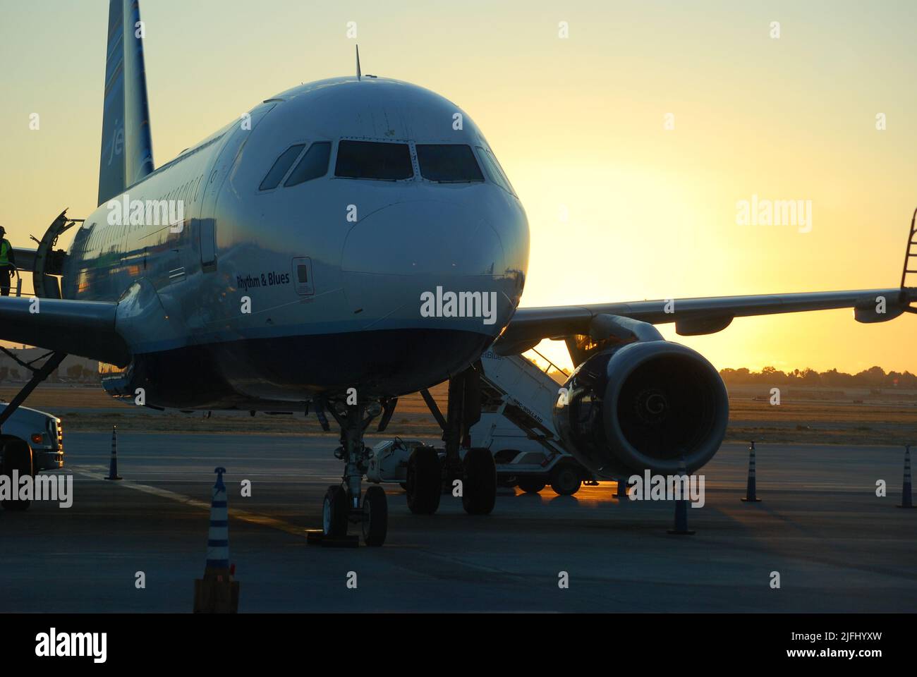 Jet sitting at an airport gate, ready to board Stock Photo - Alamy