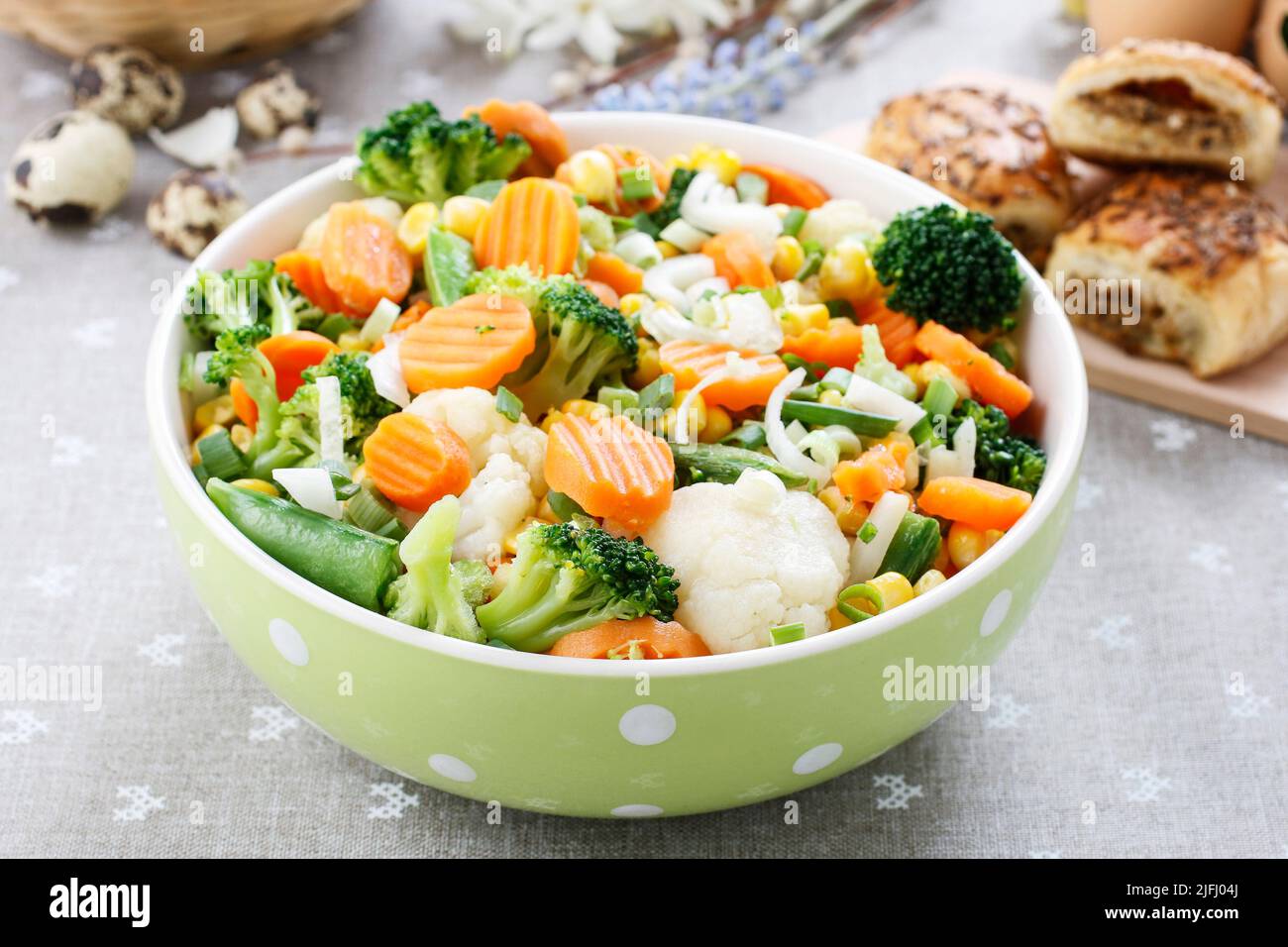 Spring vegetable salad in green dotted bowl. Healthy food Stock Photo ...