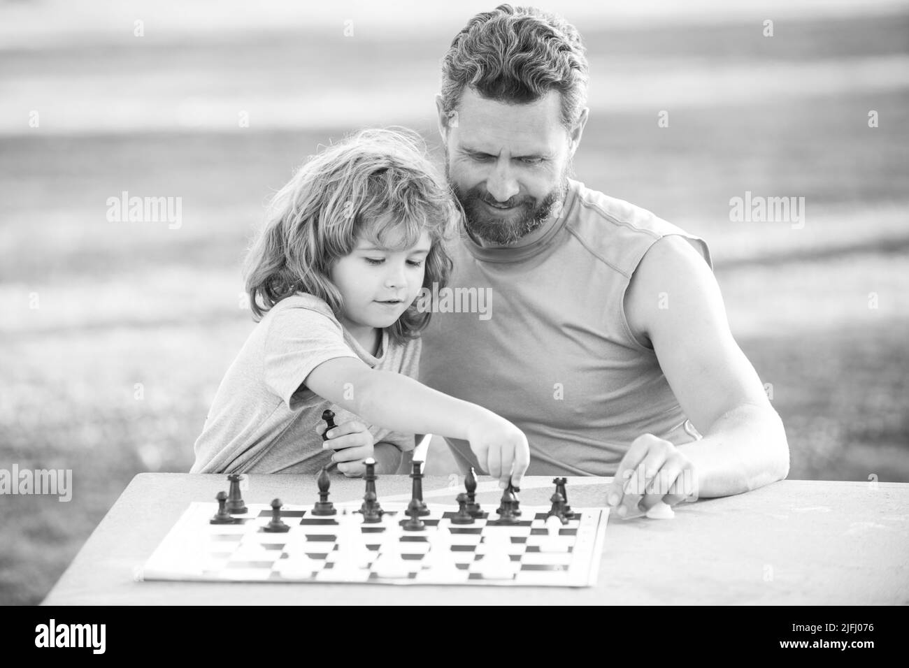 Kid play chess. Father and son playing chess. Fathers Day, love family ...