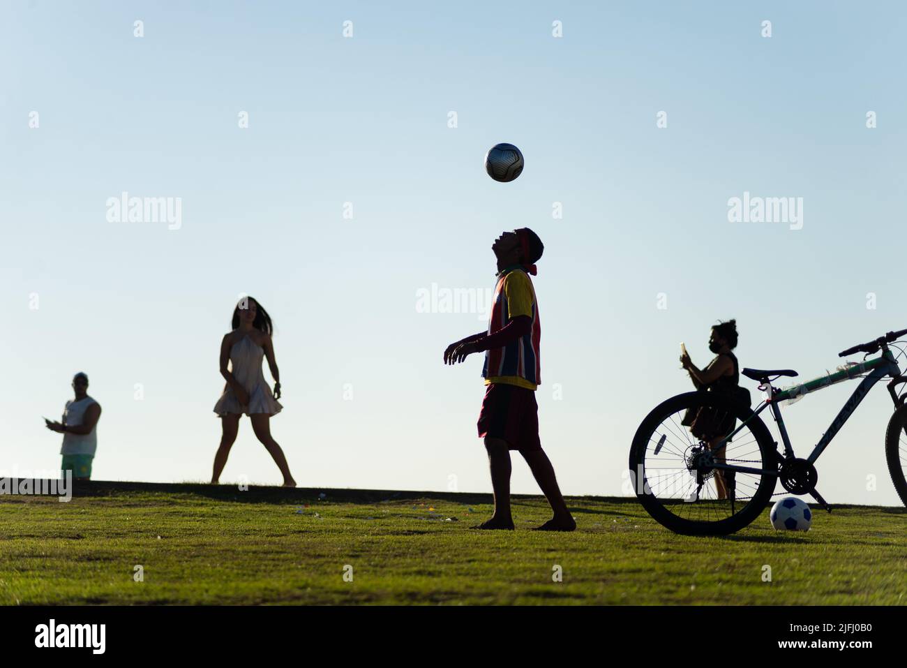 People having fun on a grass floor in Barra neighborhood in Salvador ...