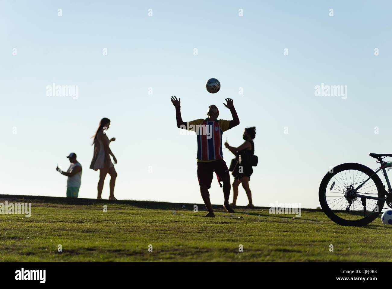 People having fun on a grass floor in Barra neighborhood in Salvador ...