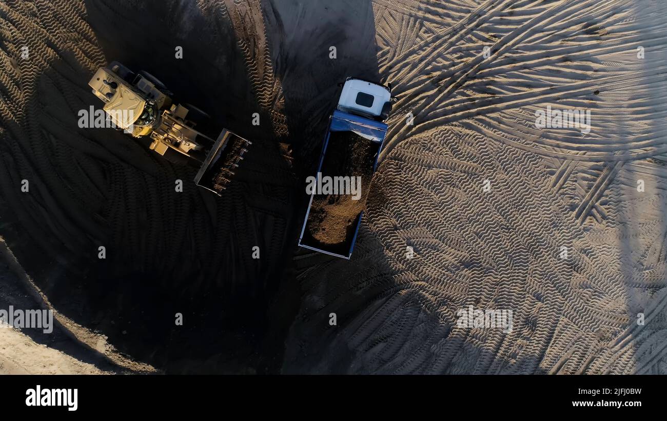 The construction process.Scene.Large machines in which cement lies and ...