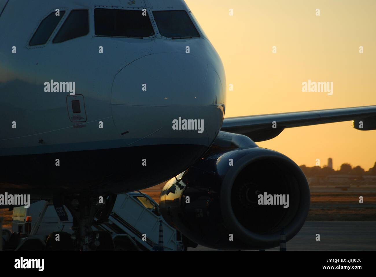 Jet sitting at an airport gate, ready to board Stock Photo - Alamy