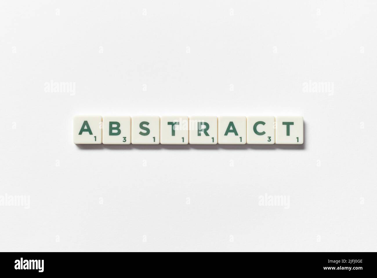 Abstract formed of scrabble tiles on white background Stock Photo - Alamy