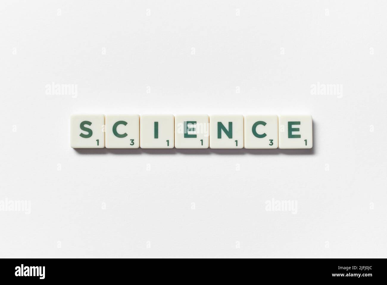 Science formed of scrabble tiles on white background Stock Photo - Alamy