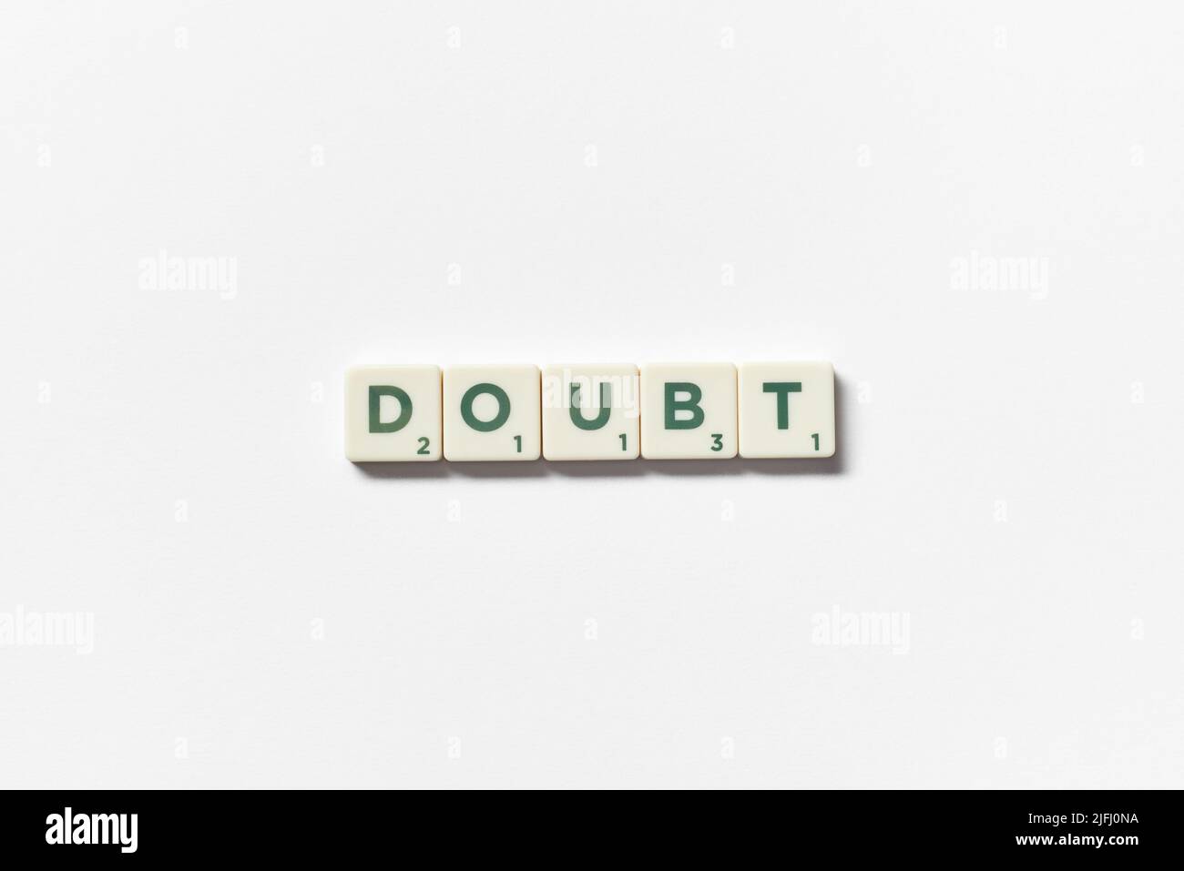 Doubt formed of scrabble tiles on white background Stock Photo - Alamy
