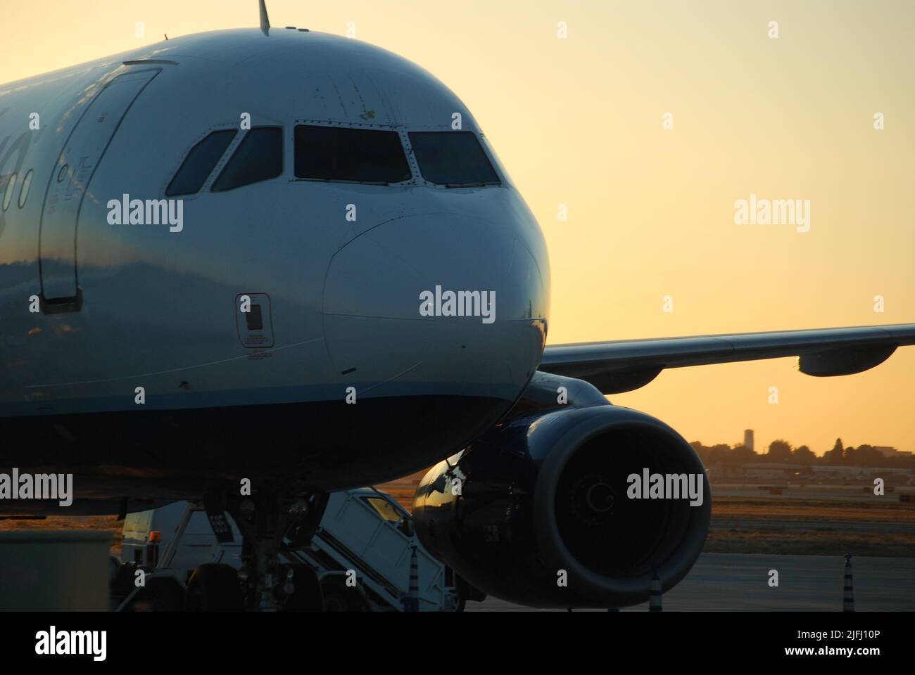 Jet sitting at an airport gate, ready to board Stock Photo - Alamy