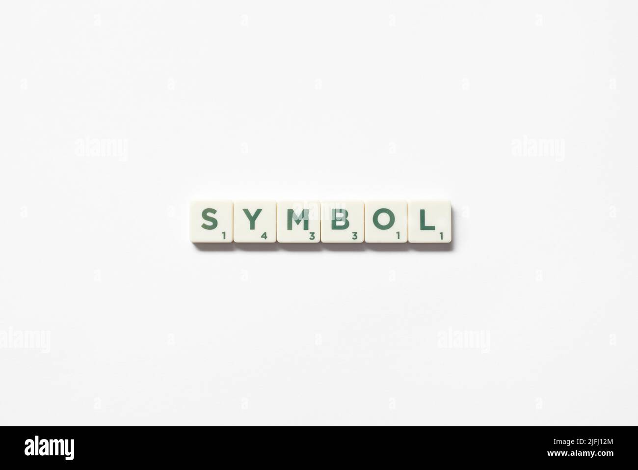 Symbol formed of scrabble blocks on white background Stock Photo - Alamy