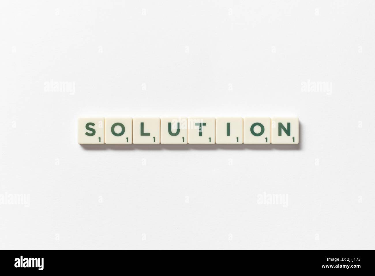 Solution formed of scrabble elements on white background Stock Photo ...