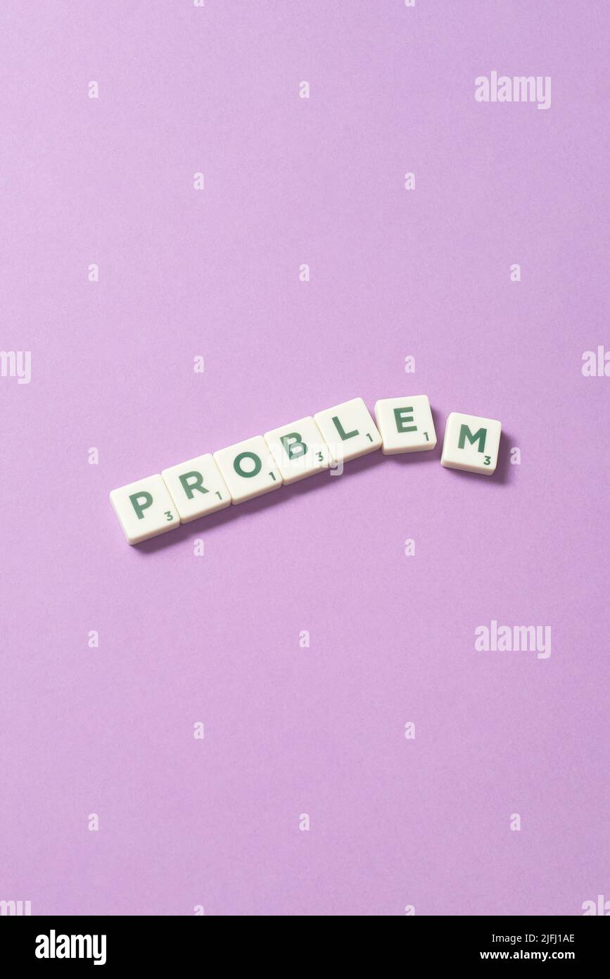 Problem formed of scrabble blocks on lilac background Stock Photo - Alamy
