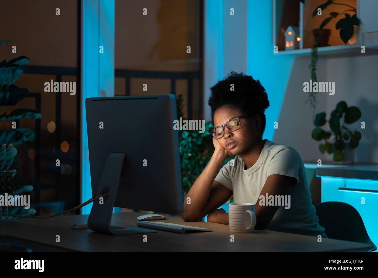 Overworked black woman in glasses working late from home, falls asleep ...