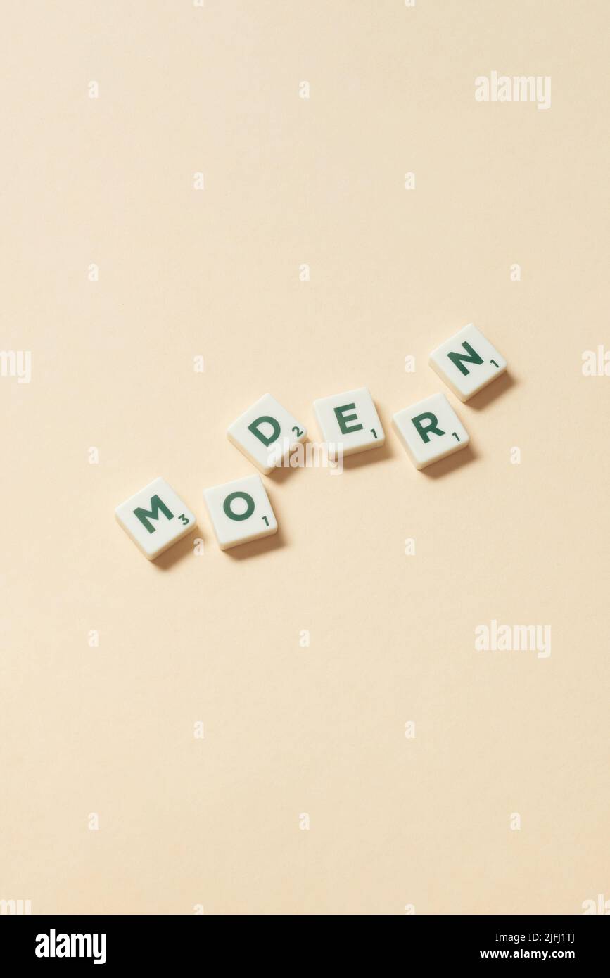 Modern formed of scrabble tiles on beige background Stock Photo - Alamy