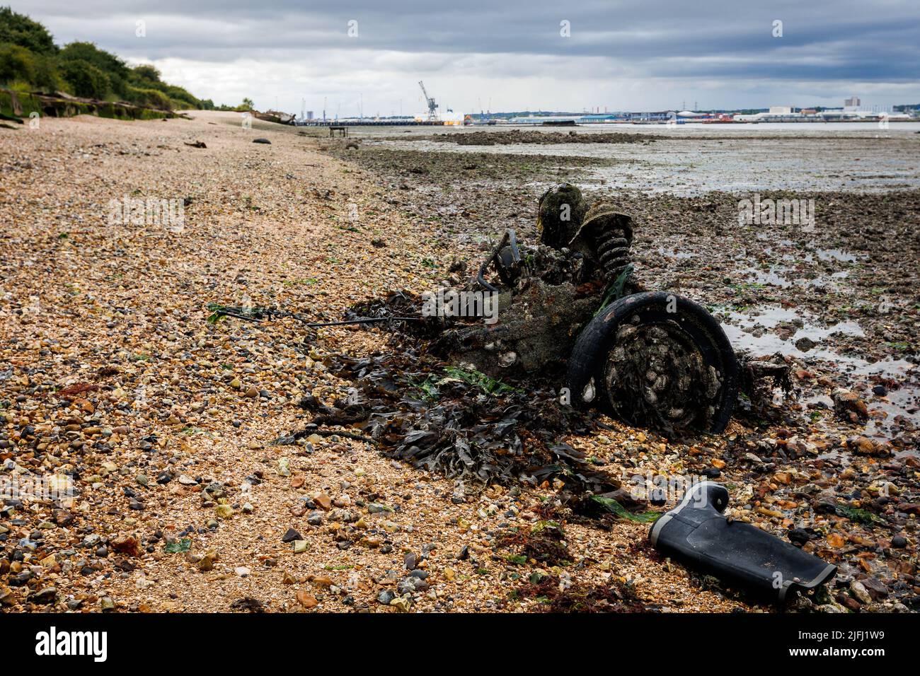 Rubbish rusting on beach Stock Photo - Alamy