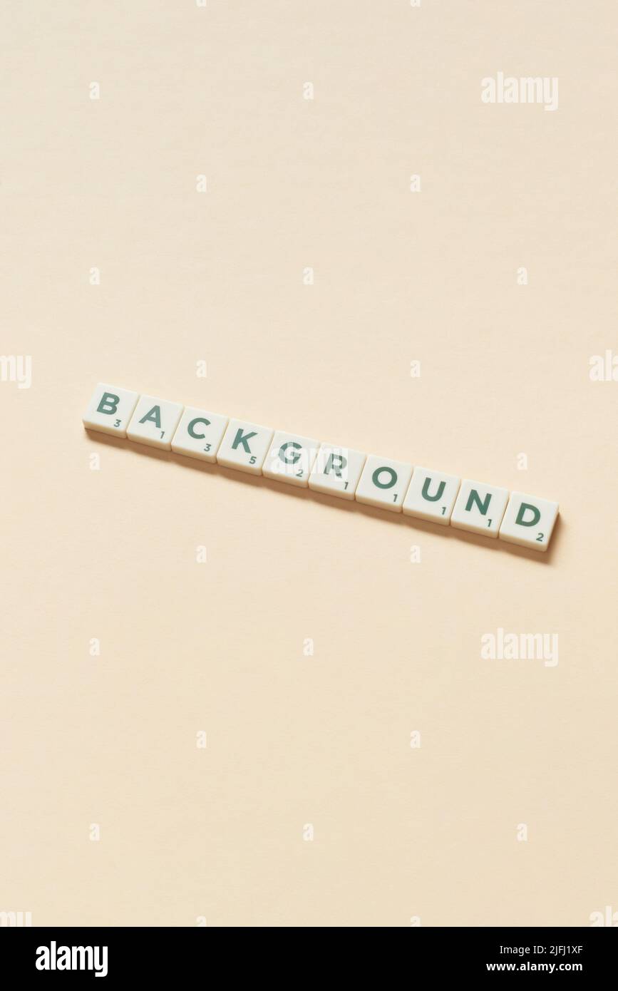 Background formed of scrabble tiles on beige backdrop Stock Photo - Alamy