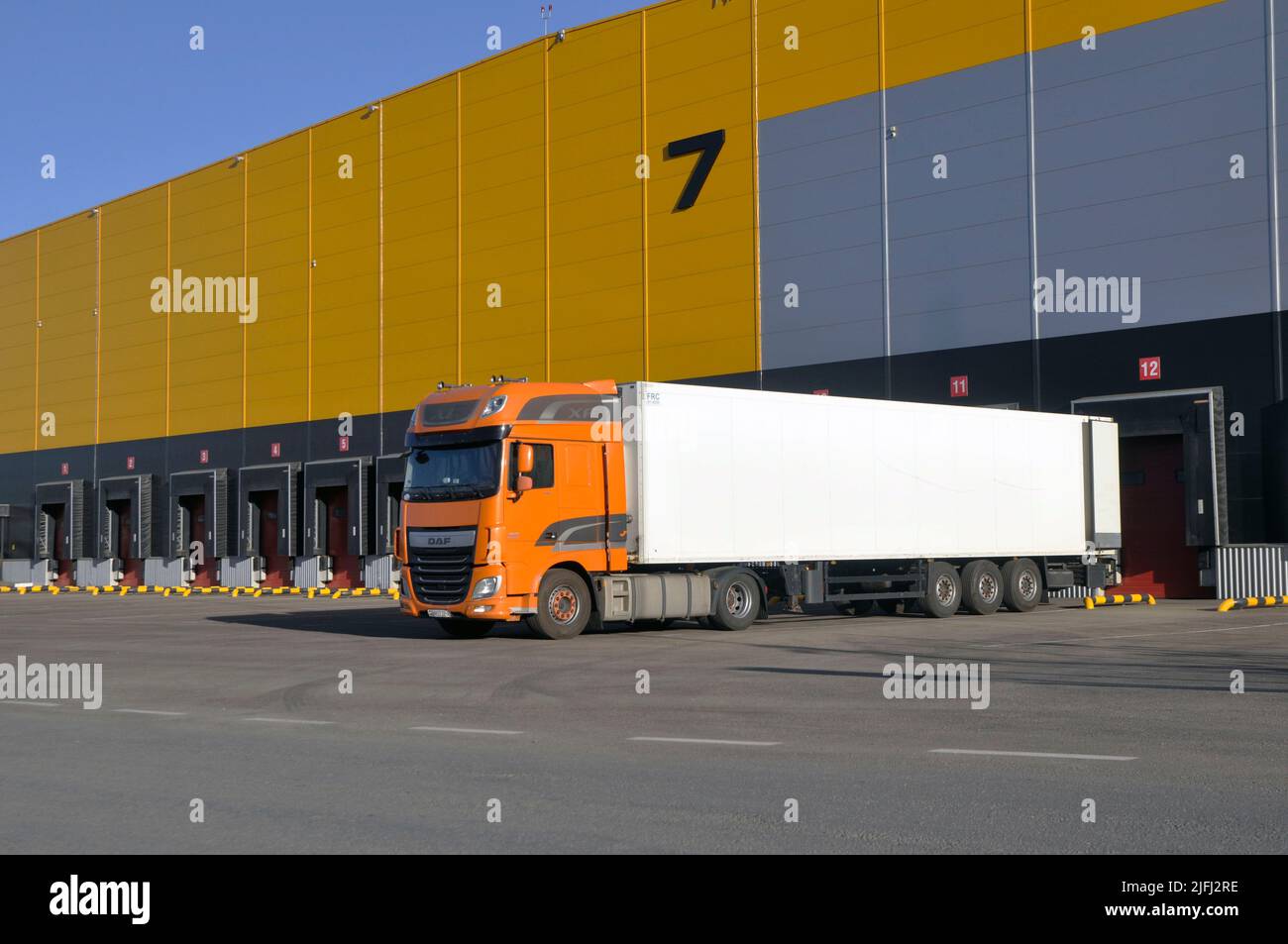 Modern logistics complex. Unloading trucks in a modern warehouse Stock ...