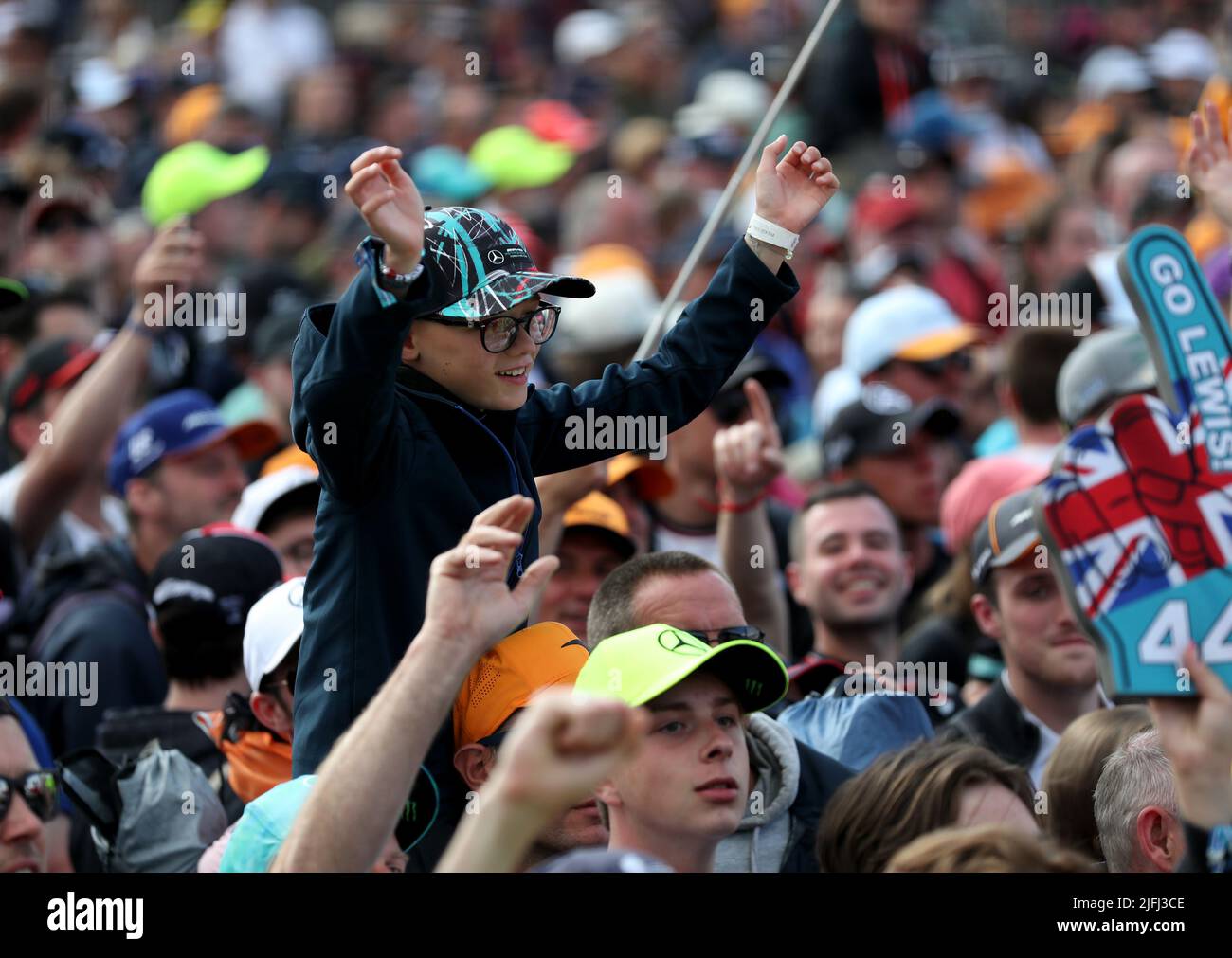 Fans gather on the circuit to watch the presentation after the British ...