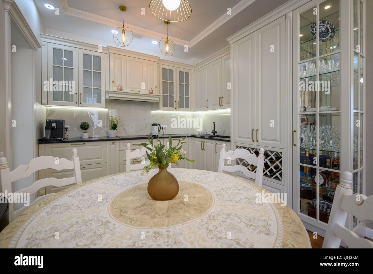 Modern white large luxurious kitchen and dining room in studio ...