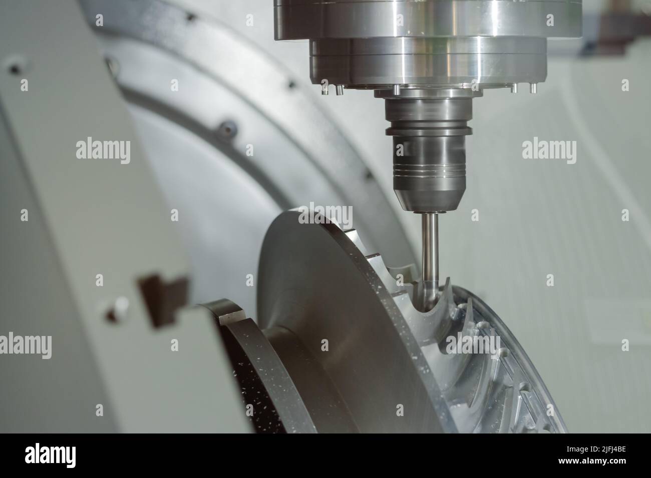 Automated cnc turning milling machine cutting metal workpiece at ...