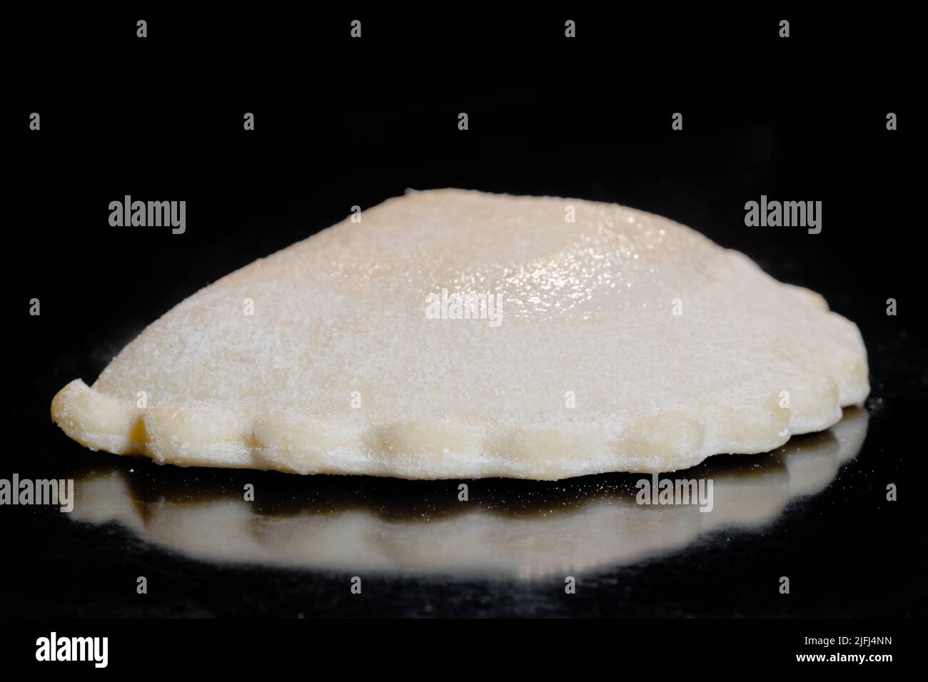 Uncooked shortcrust pastry pie, flat cake baking in electric oven Stock ...