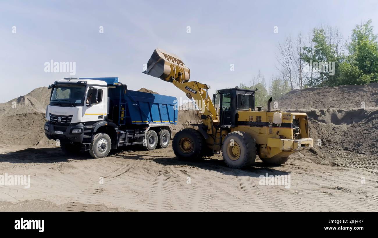 Aerial view of mining machinery. Scene. The bulldozer works at the ...
