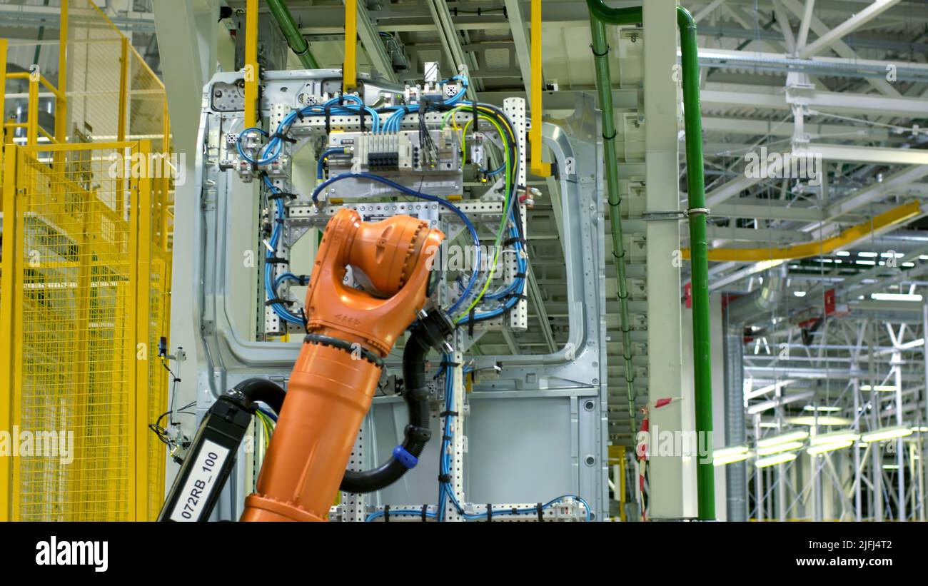 Robotic mechanism, industrial robot iin motion at the modern factory ...