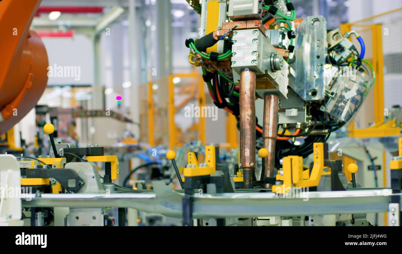 Robotic mechanism, industrial robot iin motion at the modern factory ...