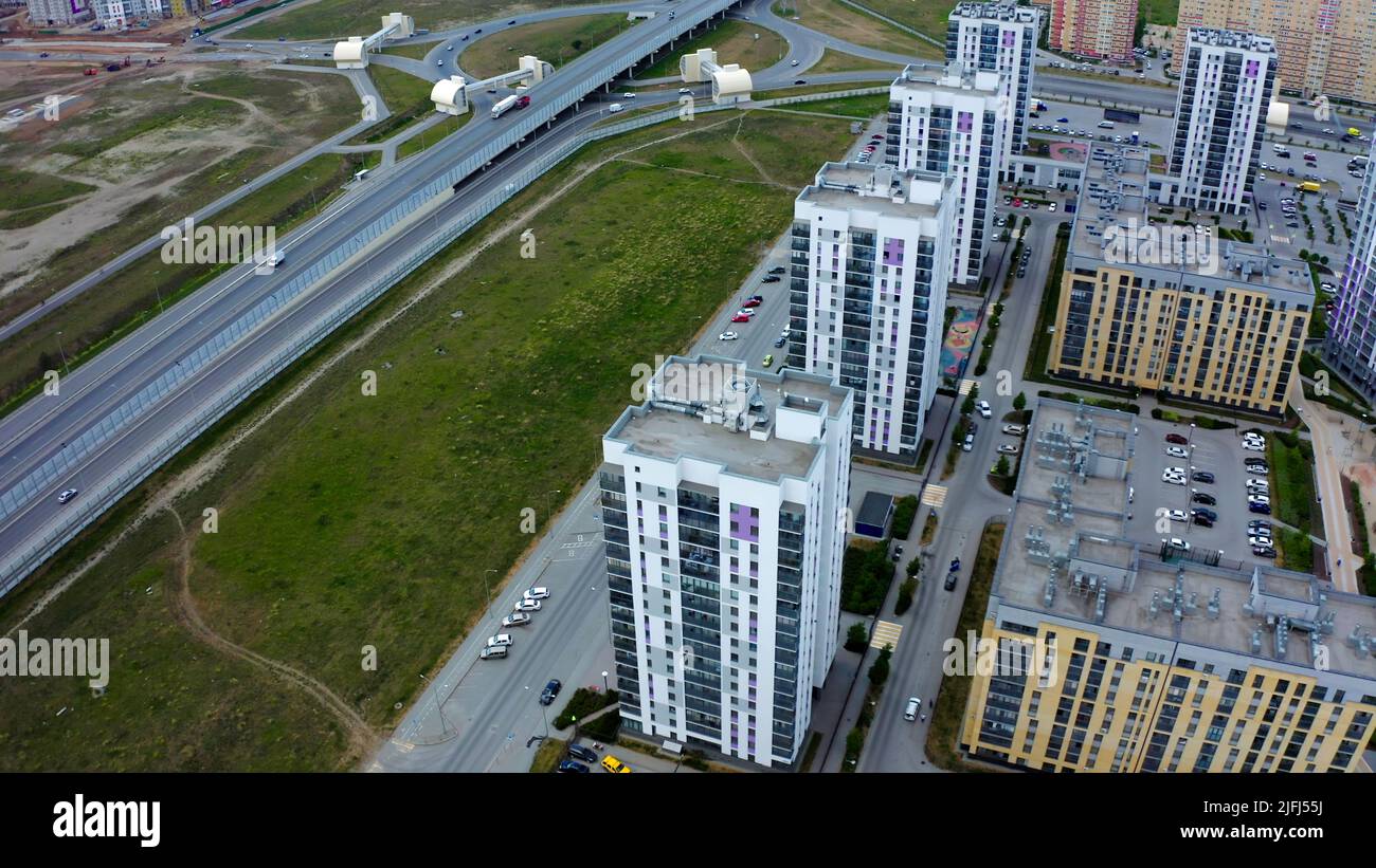 Aerial view of an apartment housing complex and parking space near ...