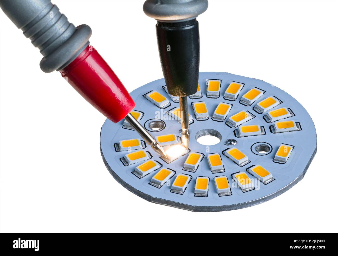 Pointed electrical test probes on lighted LED diode isolated on a white ...