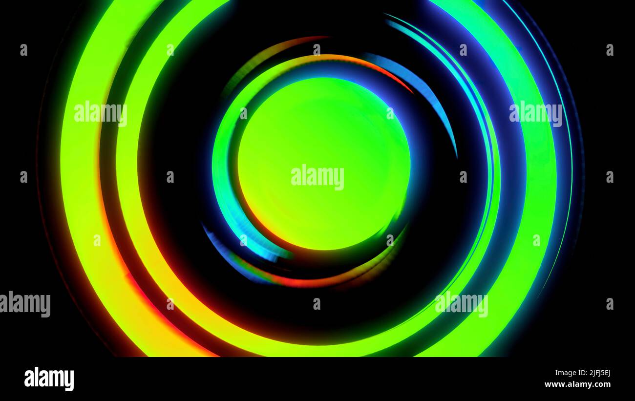 Abstract rainbow colors light rings spinning around a circle, seamless ...