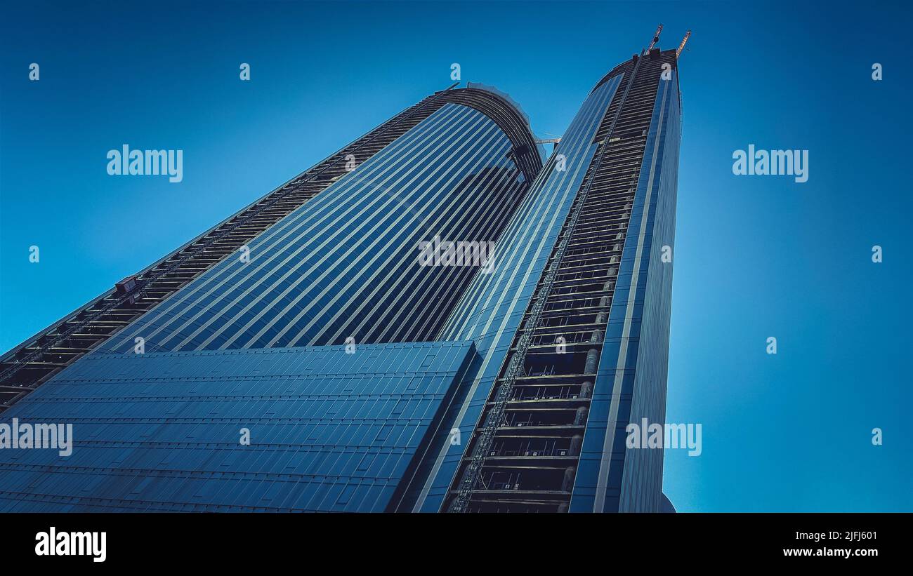 Construction of high-rise building. Construction cranes and skyscraper ...