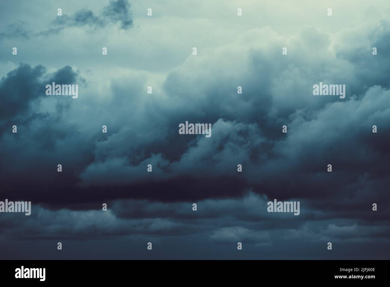 Storm sky with dark grey cumulus clouds. Thunderstorm Stock Photo - Alamy