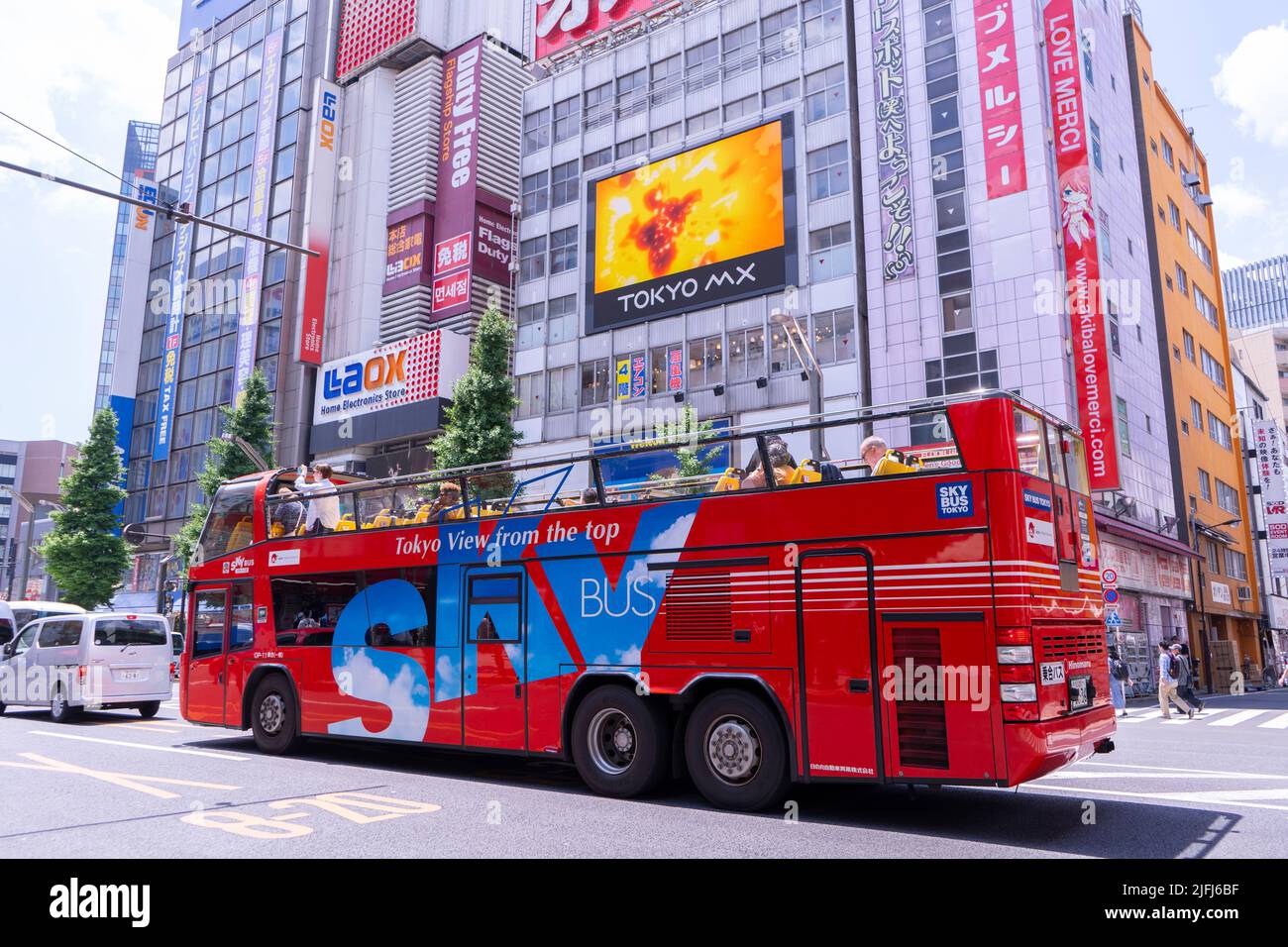 Akihabara, Japan- May 17, 2019- A sight seeing tour bus passes through ...