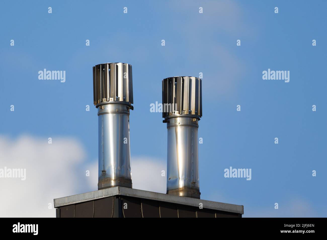 Stainless Steel Rotating Chimney Cowls on a chimney clad with slate ...