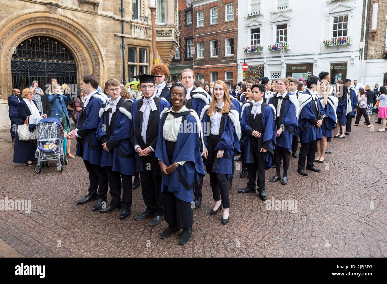 Cambridge graduates attend their graduation ceremony this morning at ...