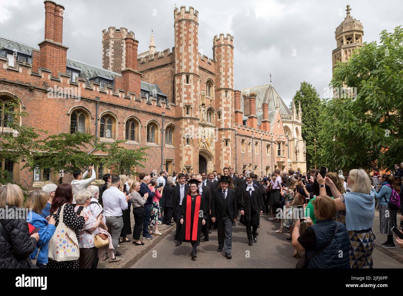 Cambridge graduates from Trinity College leave their college to attend ...