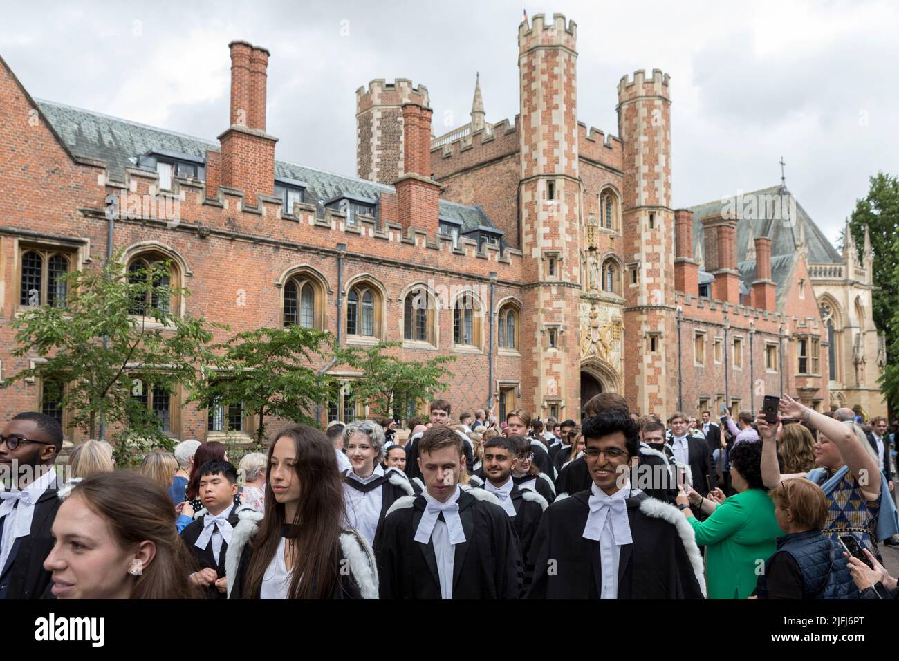 Cambridge graduates from Trinity College leave their college to attend ...