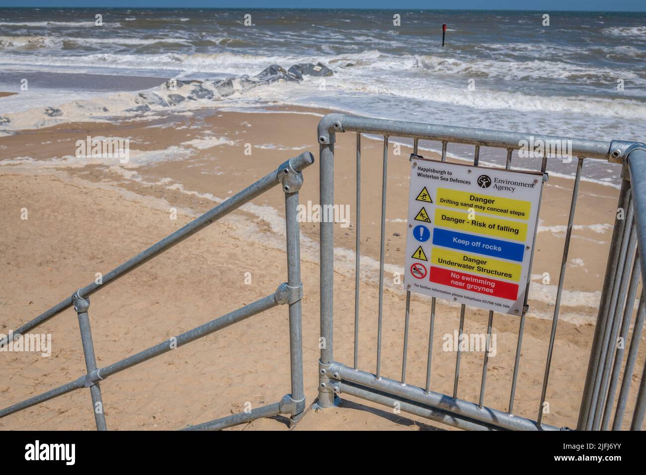 Enviromental agency warning and danger sign at Horsey Gap sea defences ...
